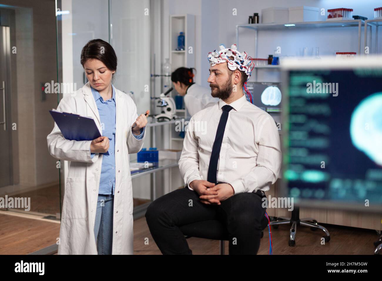 Specialist neurologist researcher monitoring brain evolution developing ...