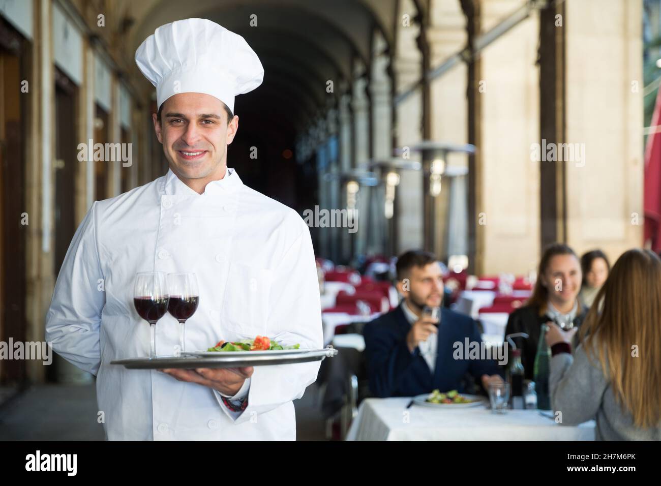 Professional chef with serving tray Stock Photo - Alamy