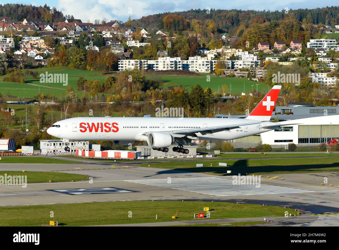 Swiss Boeing 777 landing at Zurich Airport. Airplane 777-300ER of Swiss ...