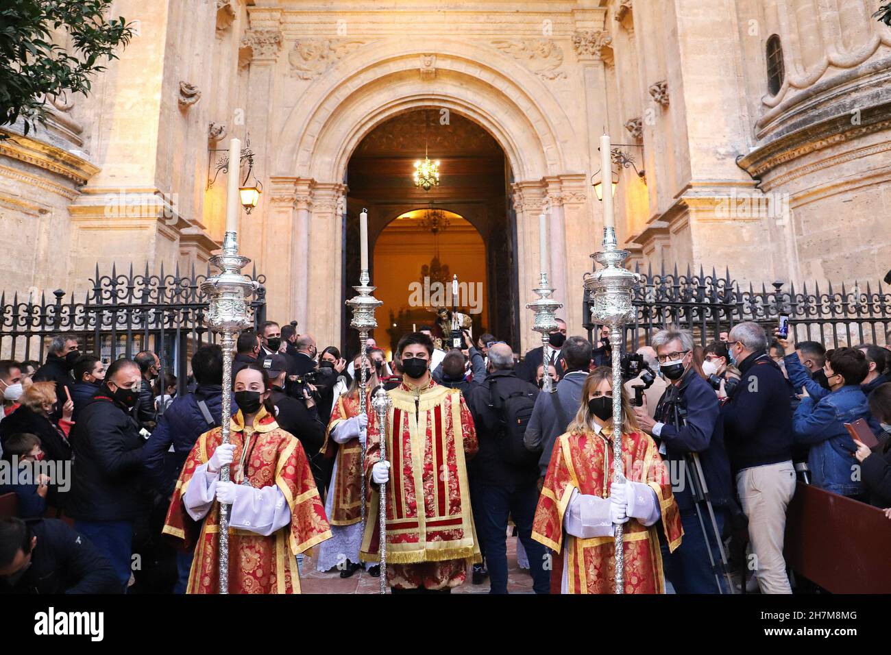 Altar servers of Cofradia de la Misericordia are seen carrying candles ...