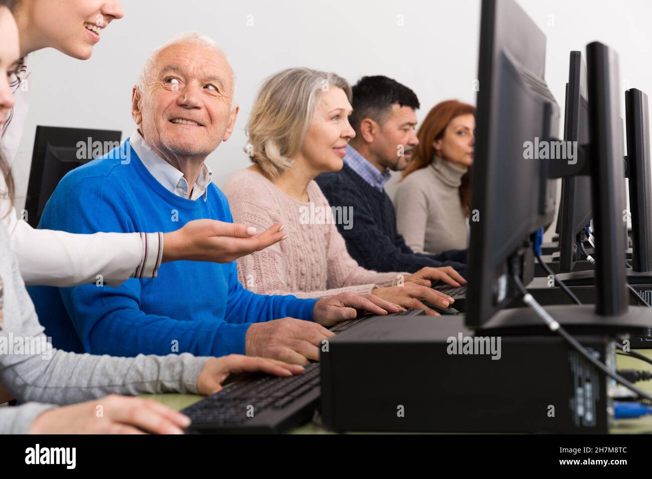 Serious businesswoman helping man hi-res stock photography and images ...