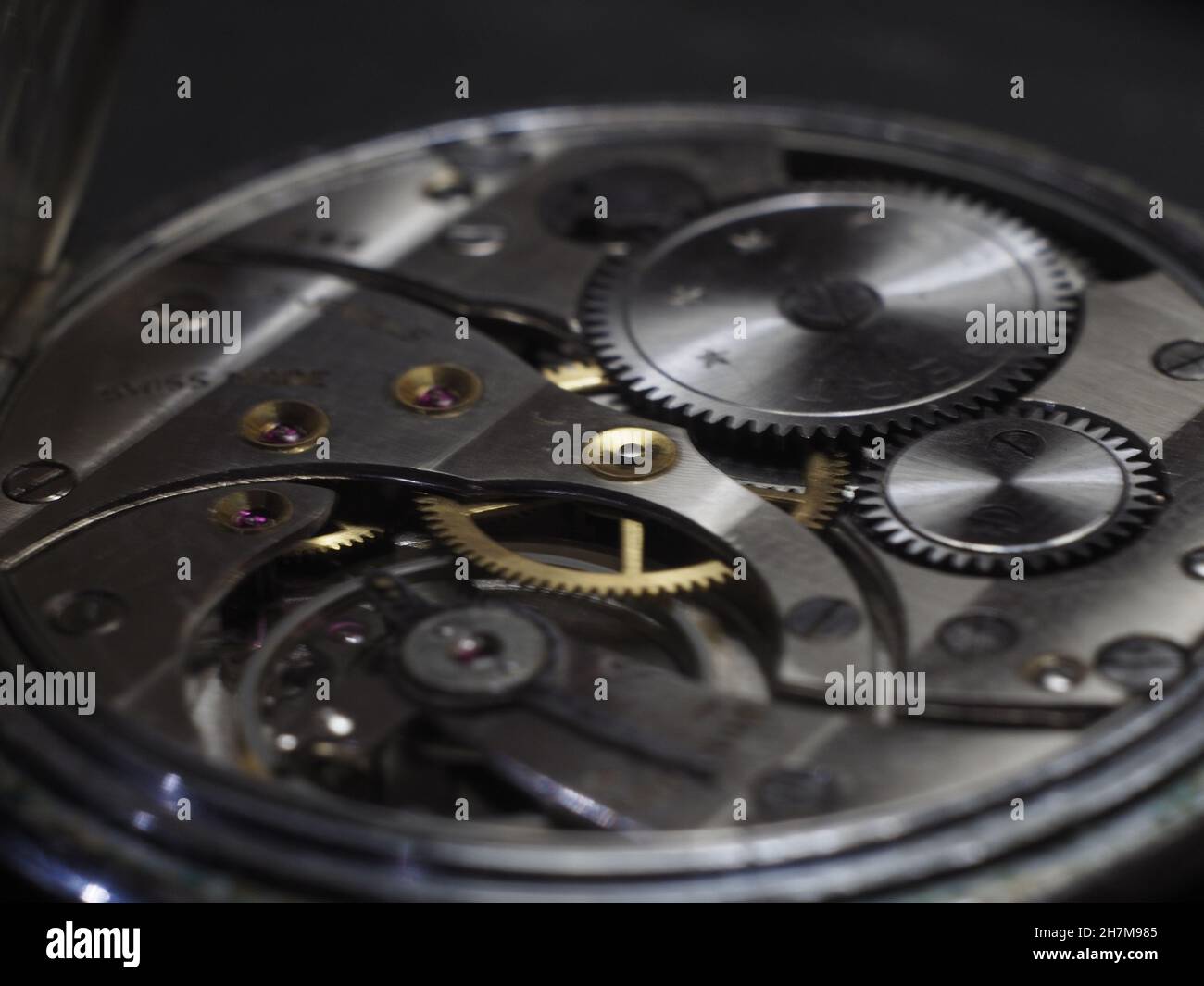 Closeup of hand watch mechanism gears under the lights Stock Photo - Alamy