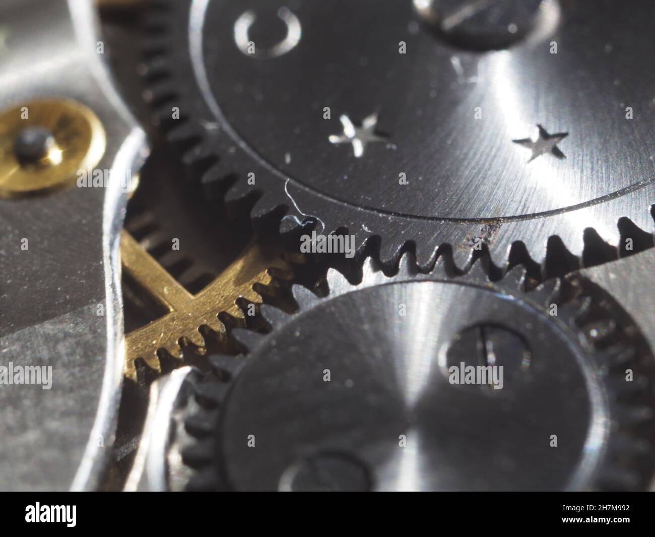 Closeup of hand watch mechanism gears under the lights Stock Photo - Alamy