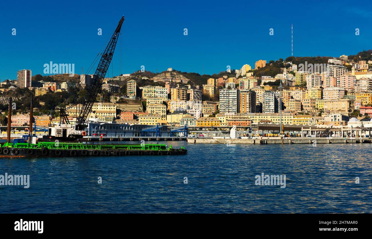 Old port of Genova city with cargo boats with crane at coast line Stock ...