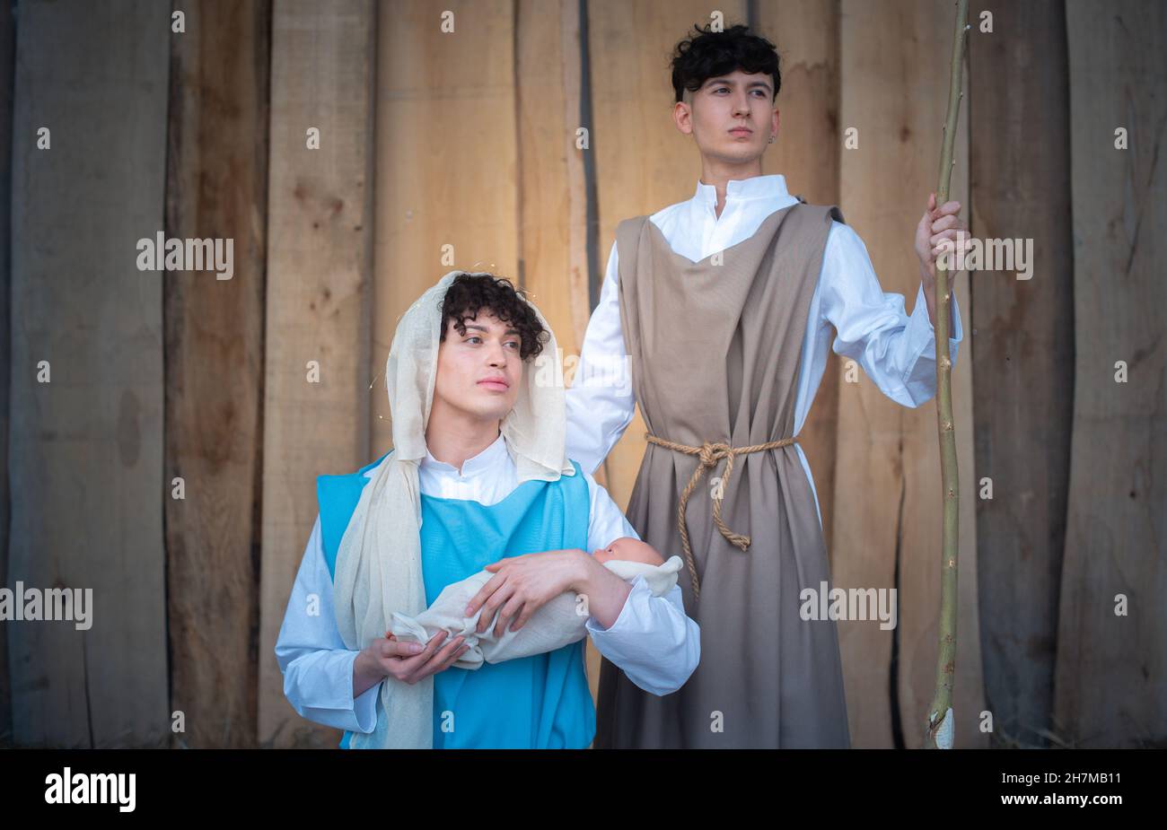 Nativity scene represented by androgynous people with staring gaze ...