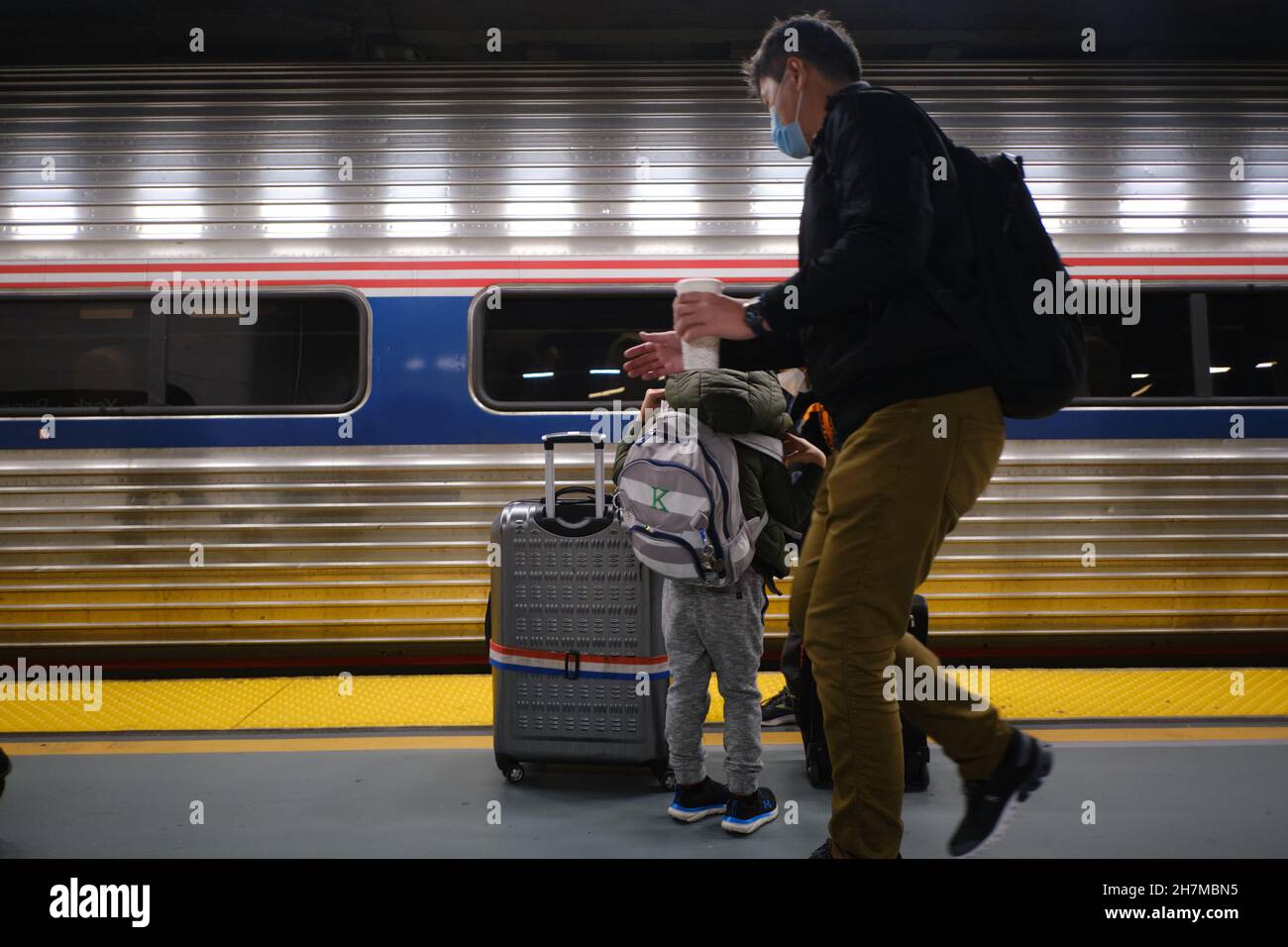 New York, New York, USA. 23rd Nov, 2021. Travelers on Amtrak platform ...