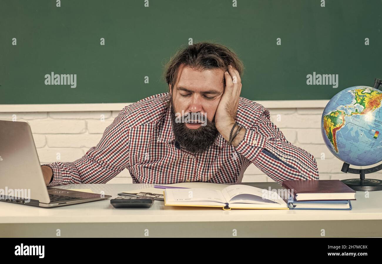 formal education. male student sit in school classroom while hard ...