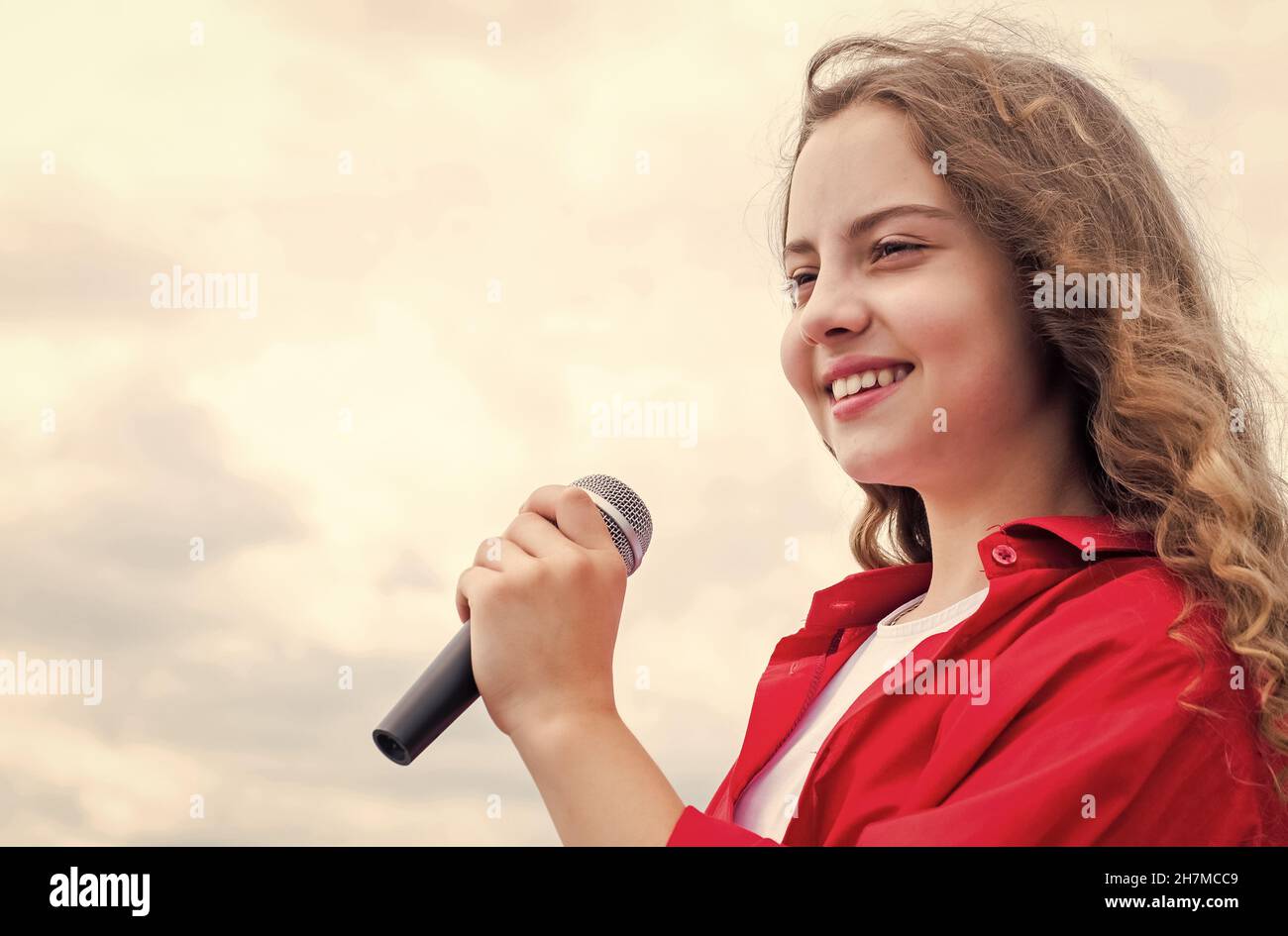 happy kid singer with mic love music, vocal school Stock Photo - Alamy