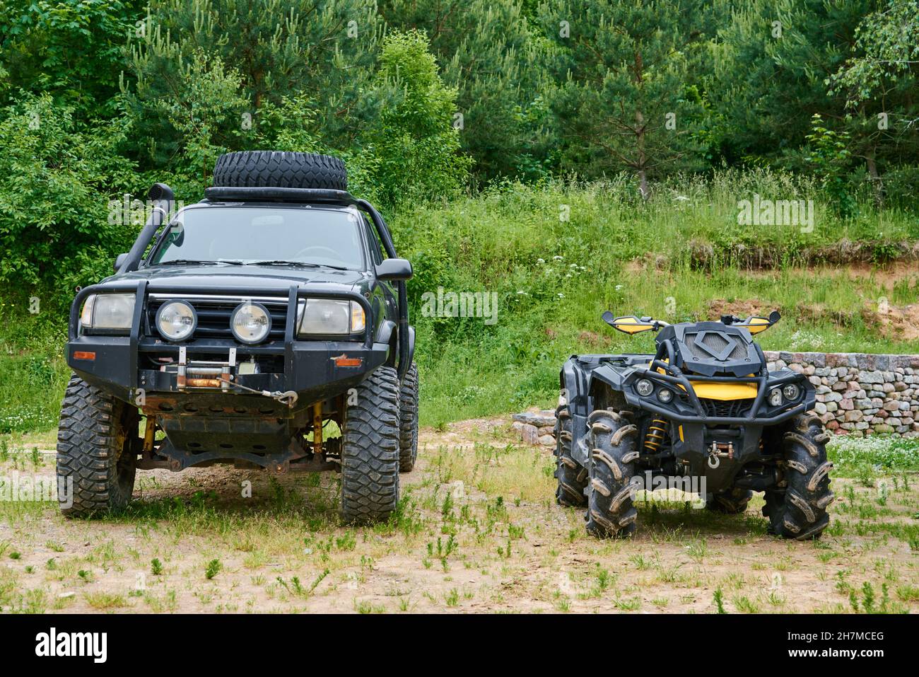 Front view of old car SUV and quad bike outdoor Stock Photo - Alamy