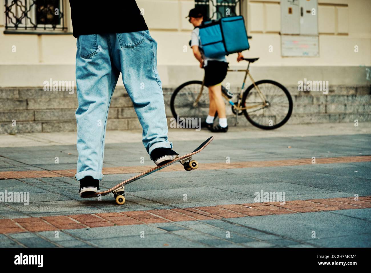 Skateboarder ride on skateboard at city street. Scater practice skate ...