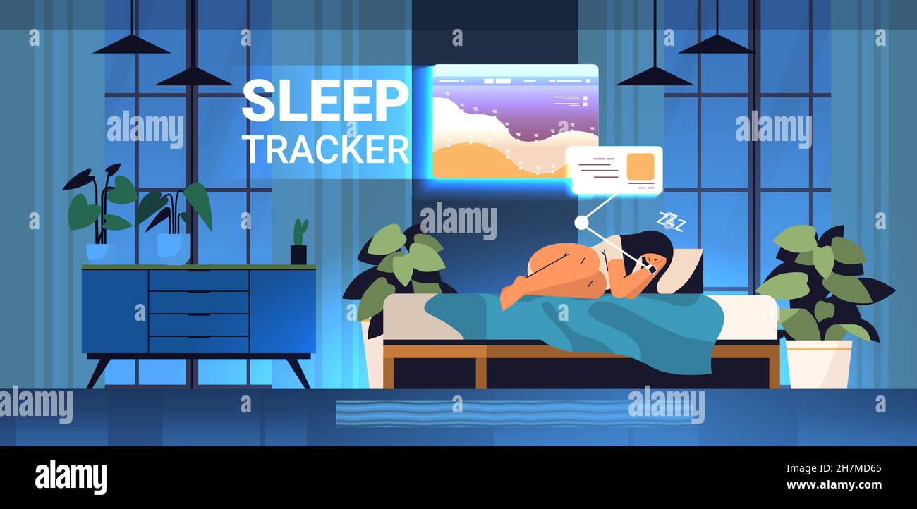 young woman sleeping in bed with electronic smart watch app tracker on ...