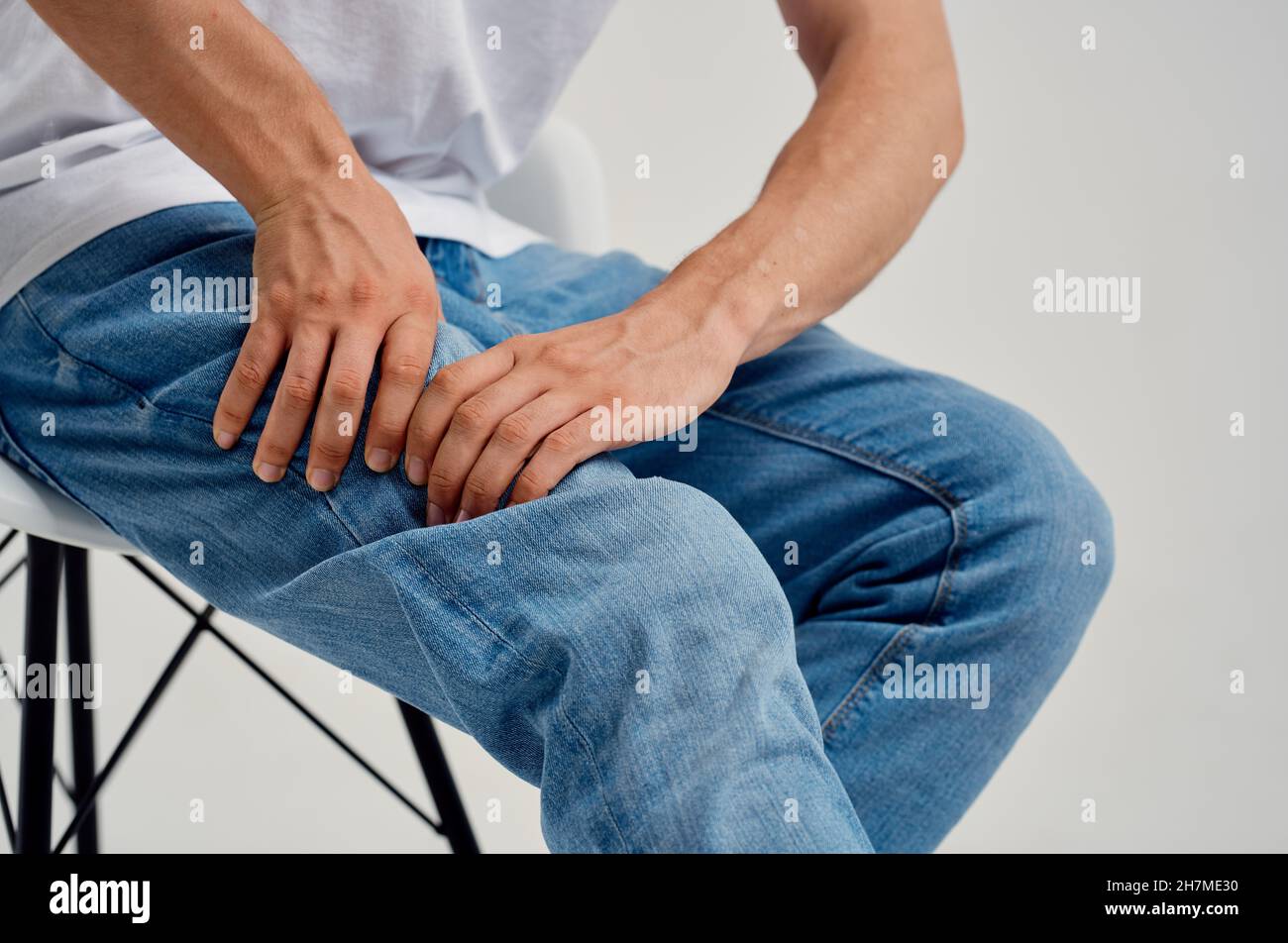 man holding his leg pain injury medicine close-up Stock Photo - Alamy