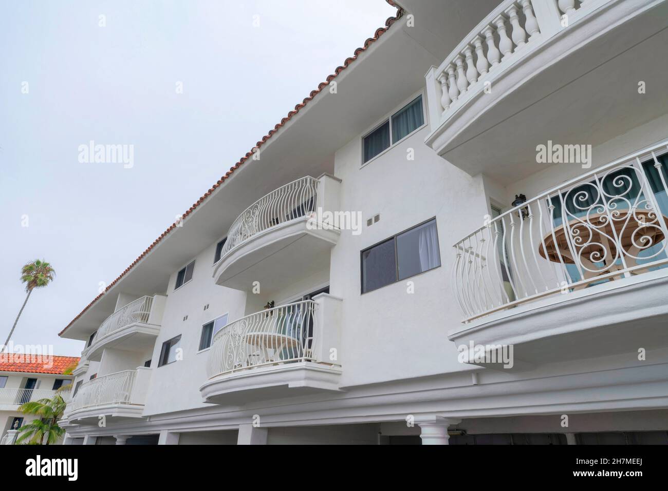White mediterranean style apartment building at Oceanside, California ...