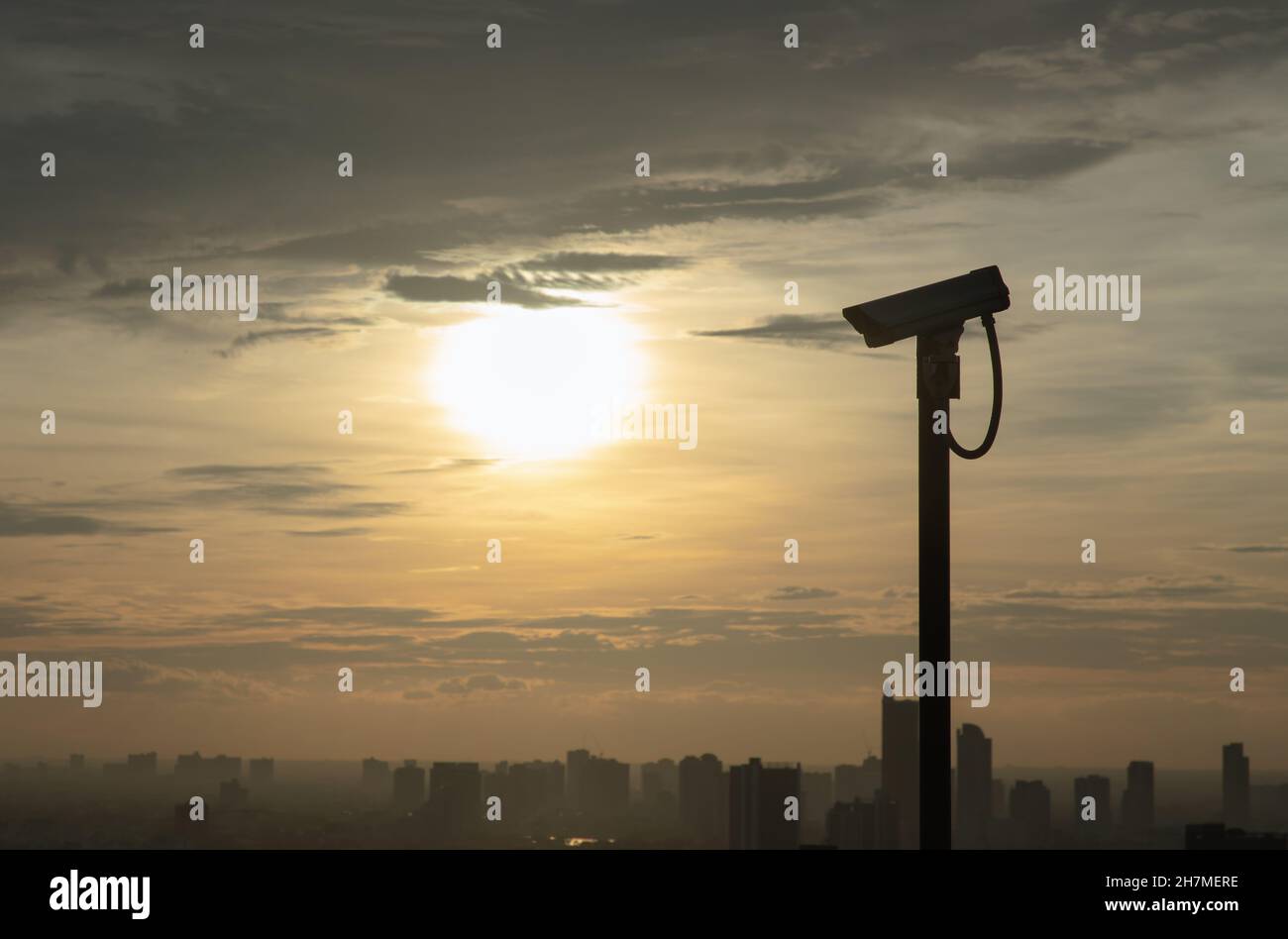 Shadow of Modern surveillance camera on cityscape and skyscraper ...