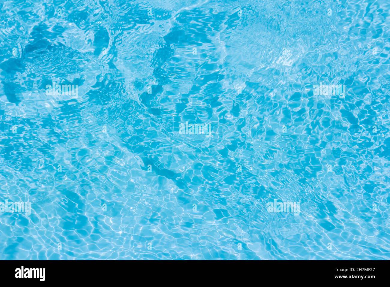 swimming pool with sunny reflections background Stock Photo - Alamy
