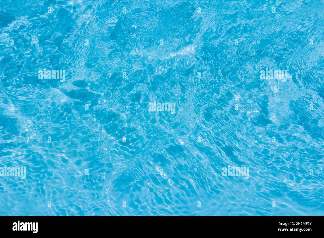 swimming pool with sunny reflections background Stock Photo - Alamy