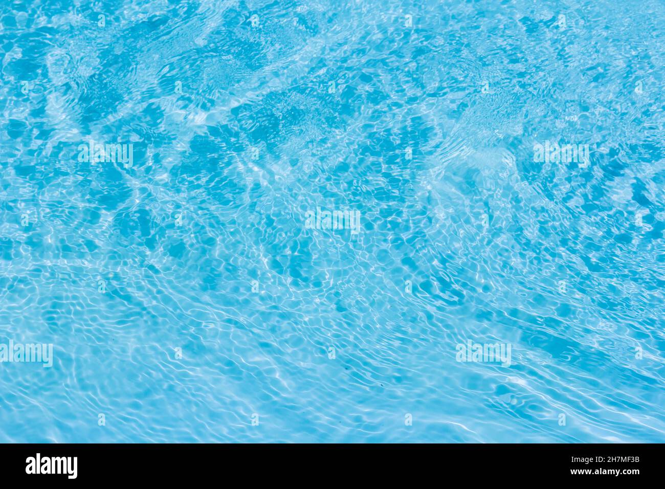 swimming pool with sunny reflections background Stock Photo - Alamy