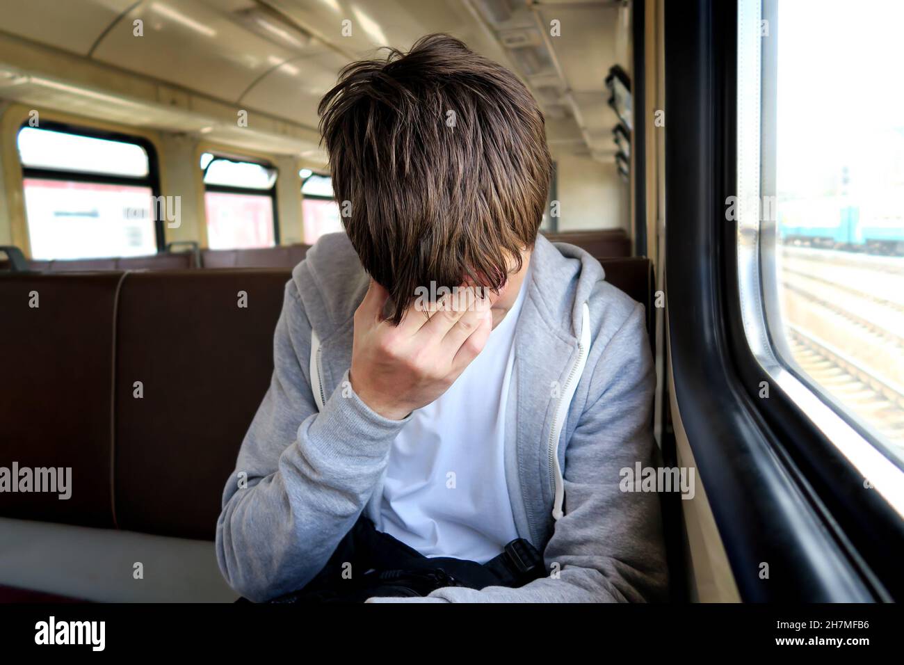 Sad Man in the Electric Train Stock Photo - Alamy