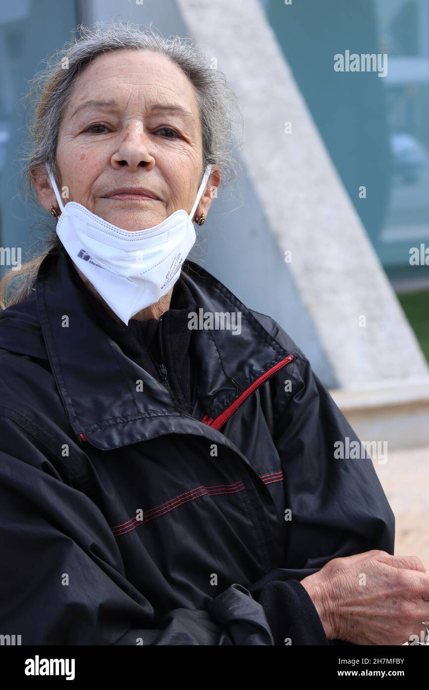 older woman with the mask down Stock Photo - Alamy