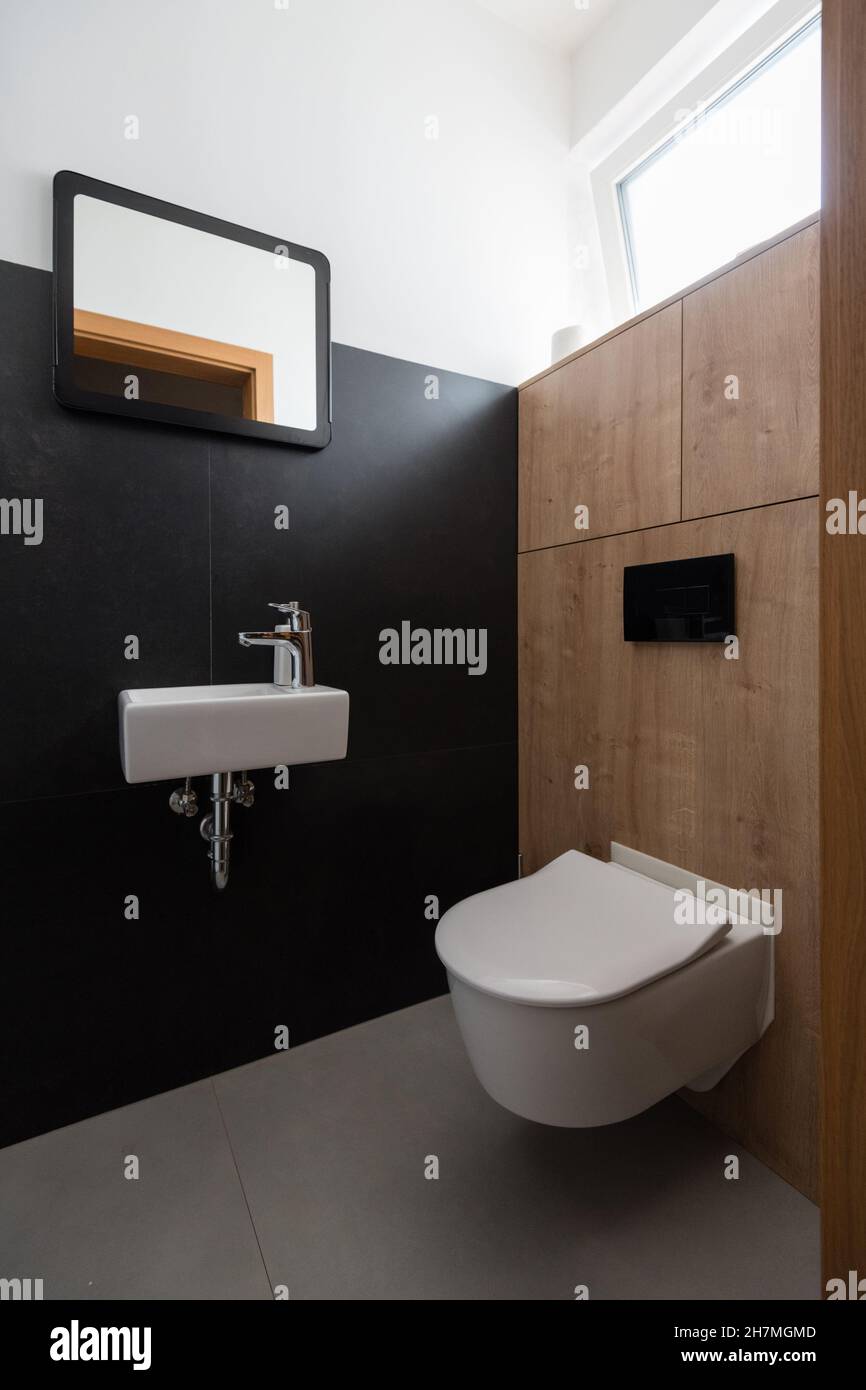 Small restroom in modern apartment Stock Photo - Alamy