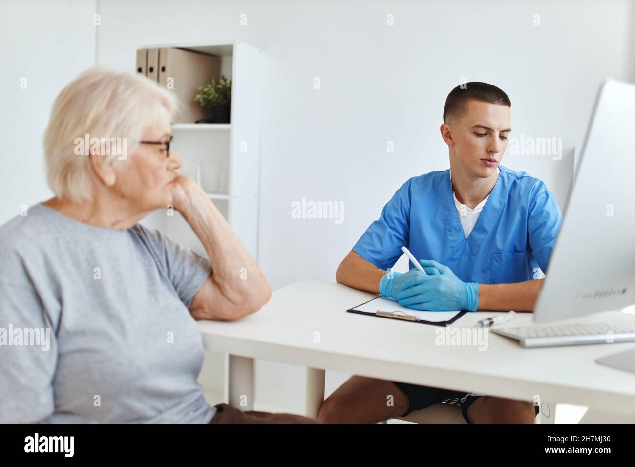 the patient is examined by a doctor diagnostics Stock Photo - Alamy
