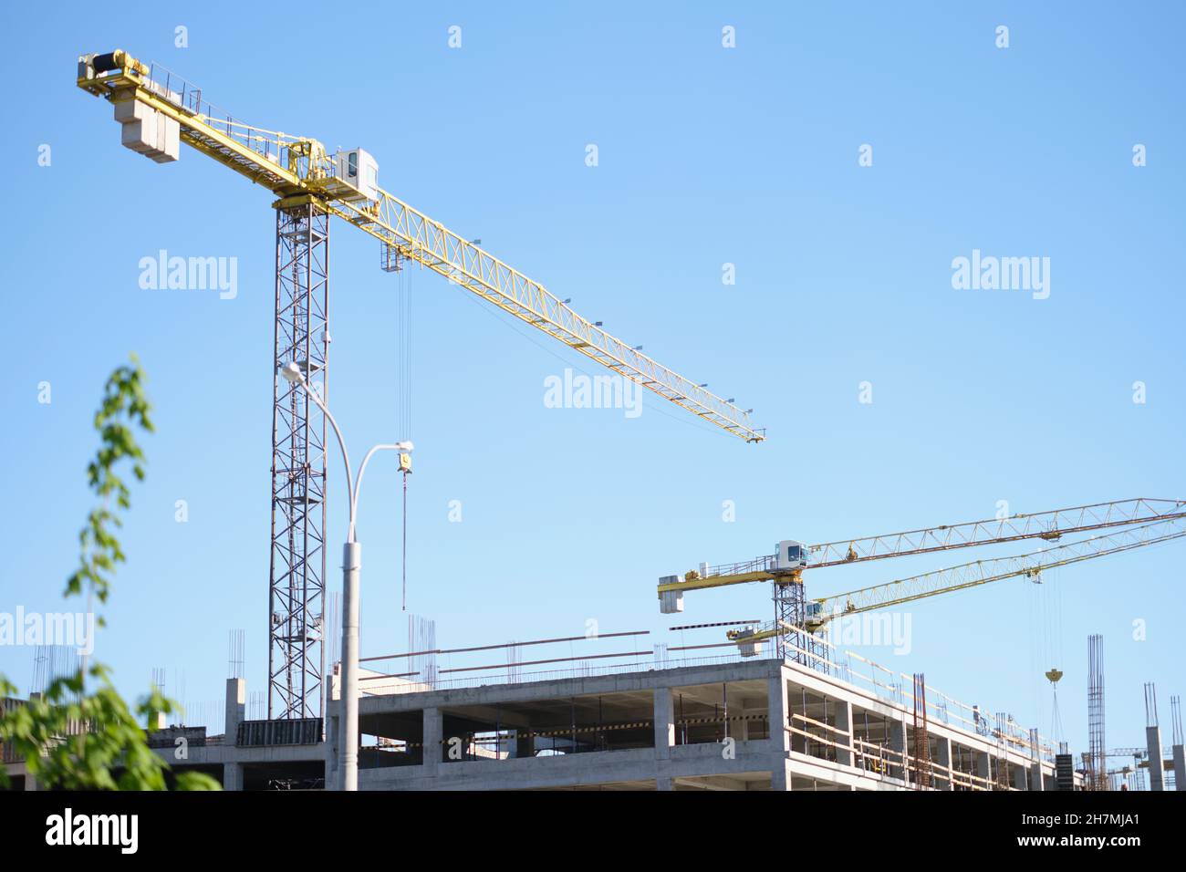 Big construction site include several cranes working on building ...
