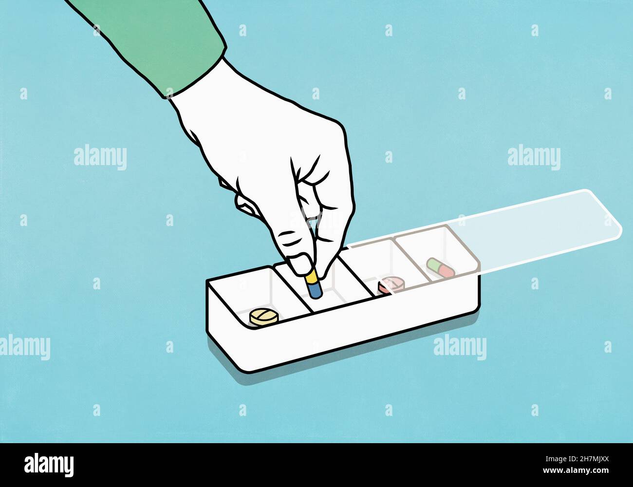 Hand reaching for medication in pill box Stock Photo - Alamy