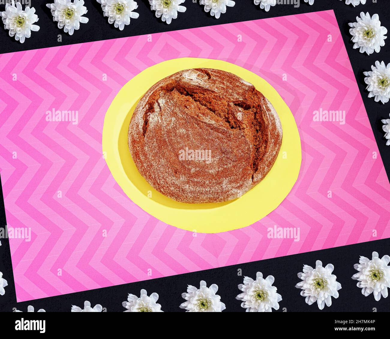View from above rustic round bread loaf on pink zigzag background Stock ...