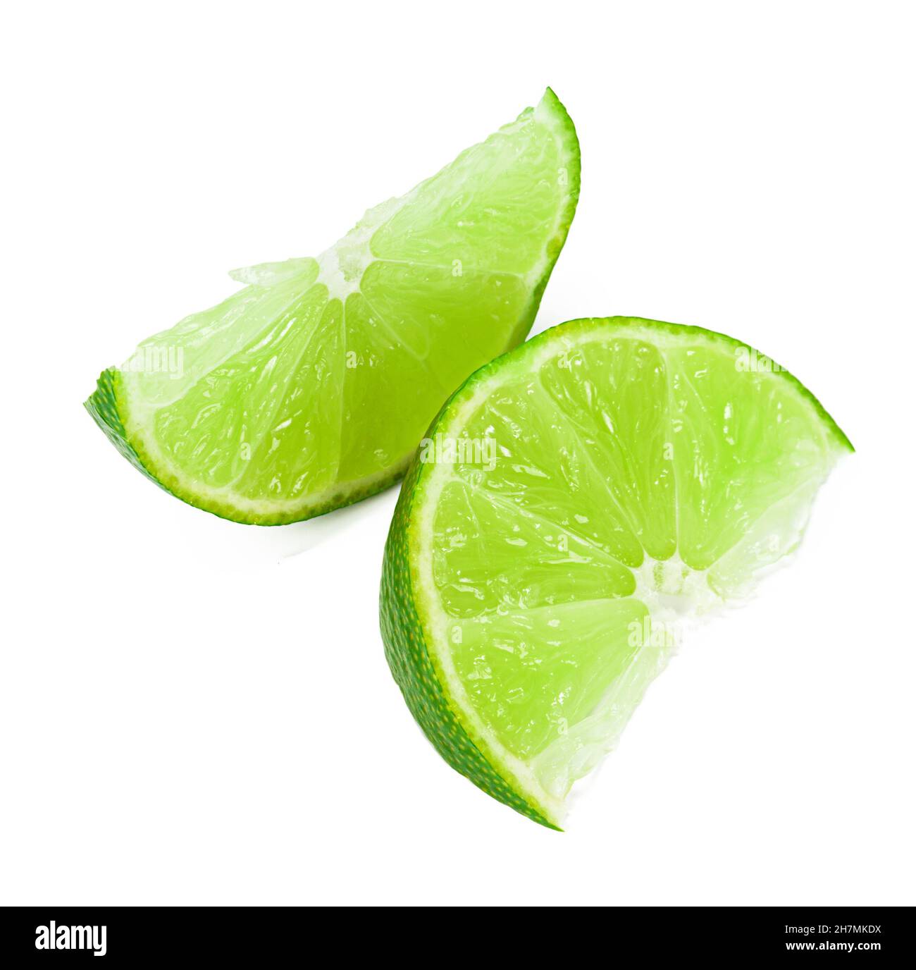 Pieces of lime isolated on white background Stock Photo - Alamy