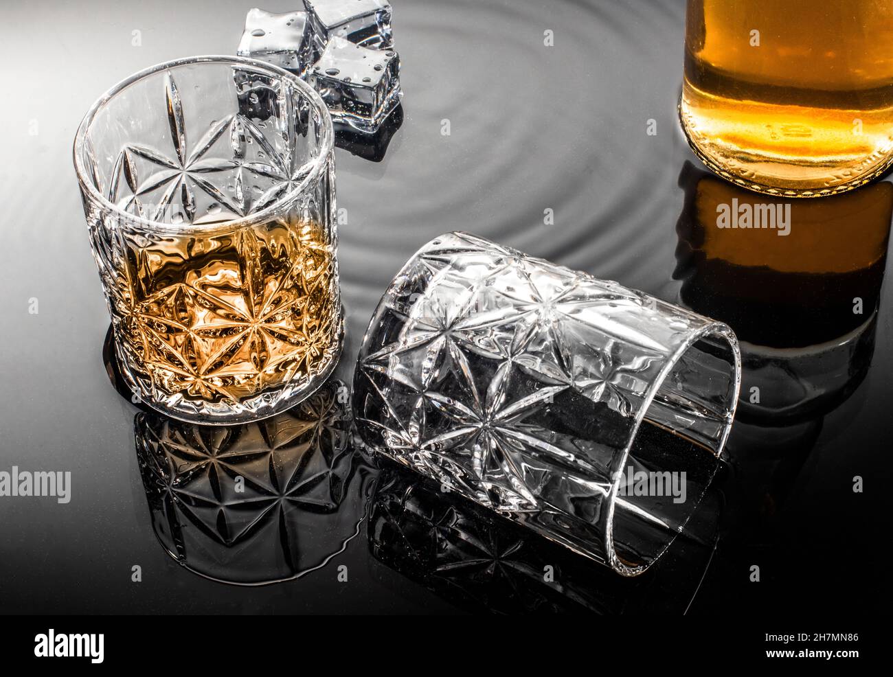 Glass Of Whisky On Water Stock Photo - Alamy