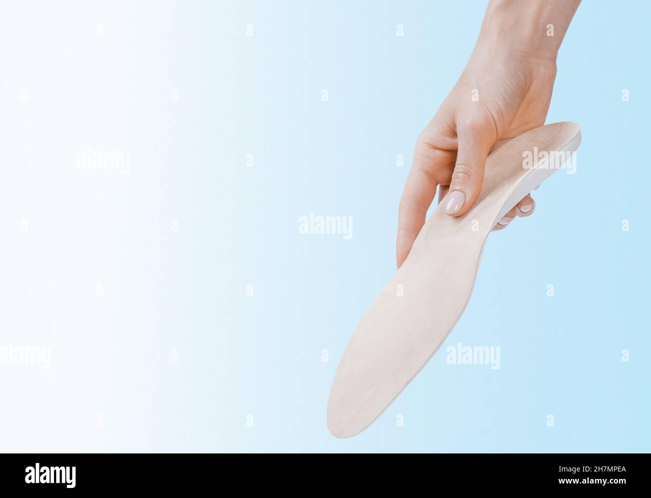 Orthopedic insole isolated on a blue background. Medical insoles ...