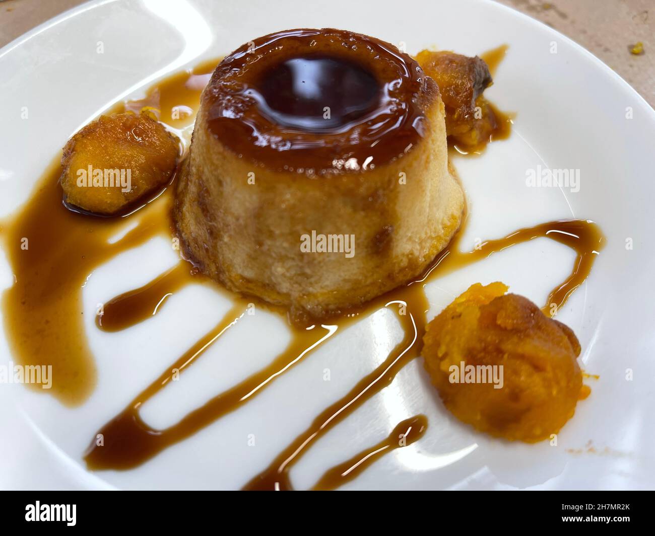 Dessert composed of egg custard and apple compote Stock Photo - Alamy