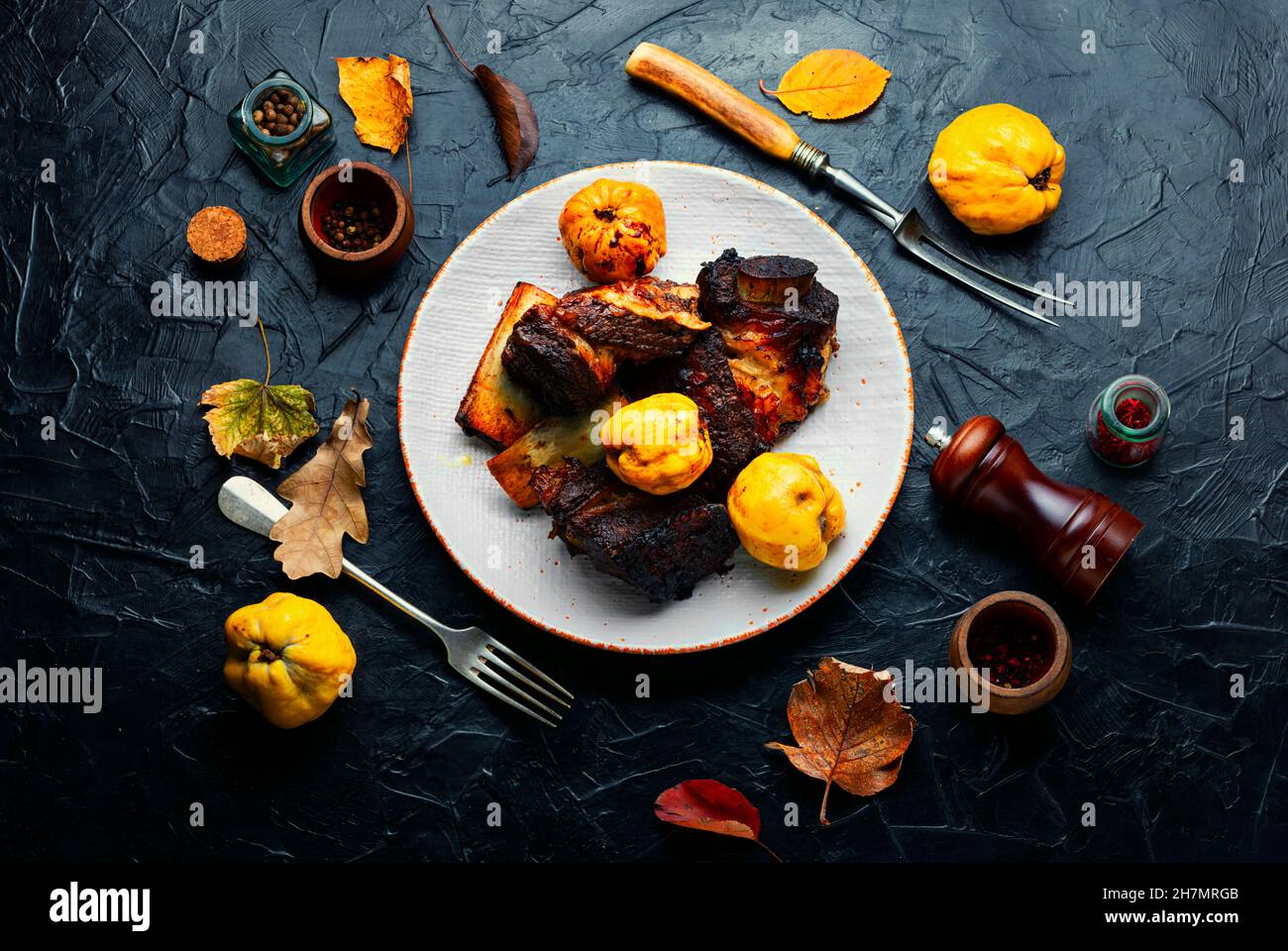 Succulent beef ribs fried with autumn quince Stock Photo - Alamy