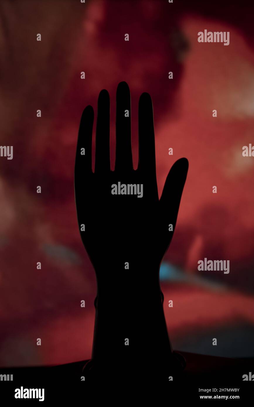 Hand in dimmed light Stock Photo - Alamy