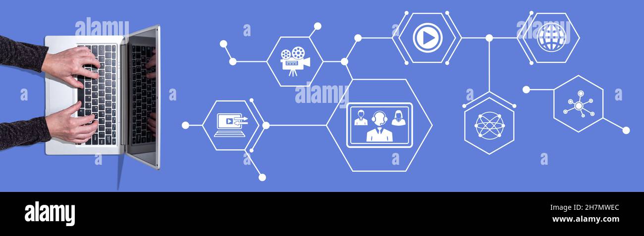 Top view of hands using laptop with symbol of video conference concept ...