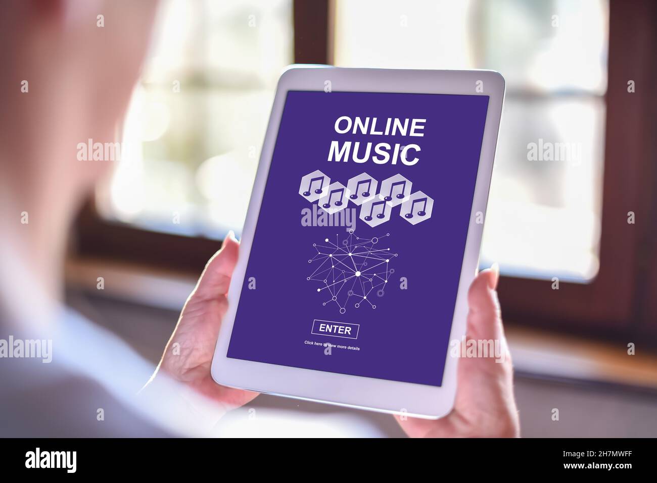 Tablet screen displaying an online music concept Stock Photo - Alamy