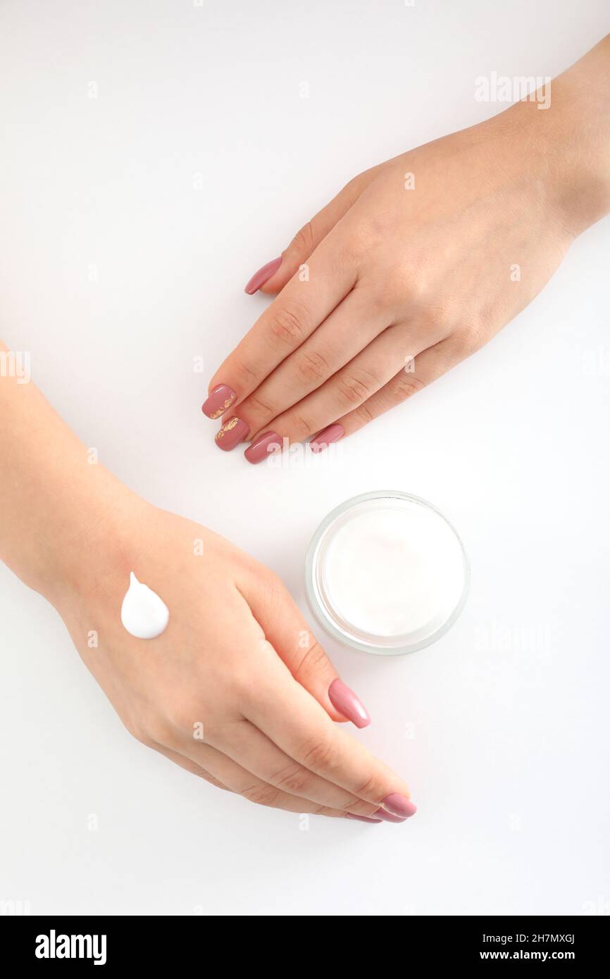 Concept of hand care with cosmetics on white background Stock Photo - Alamy