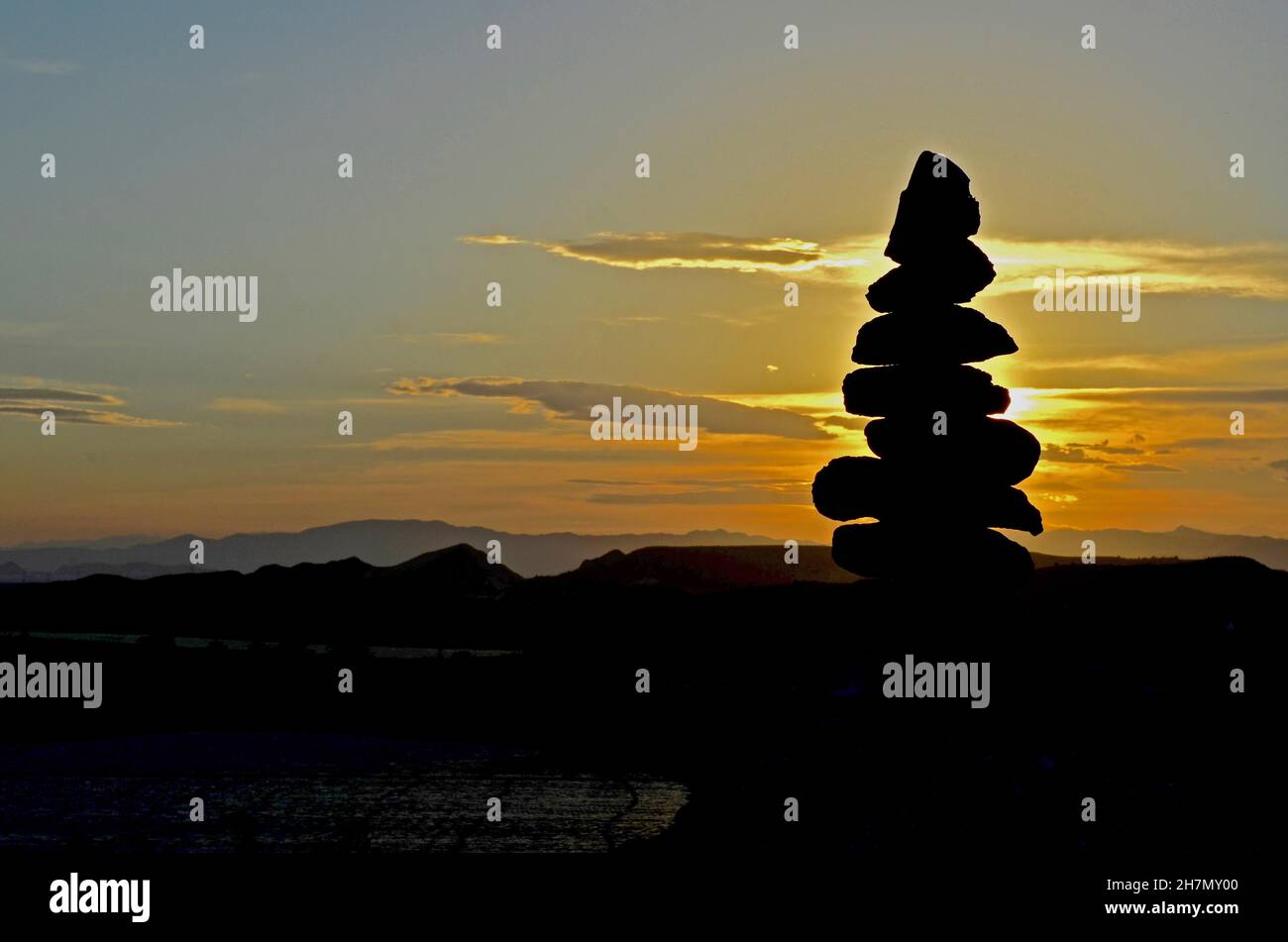 Stacked stones to form towers, Zen tower, stone tower in backlight ...