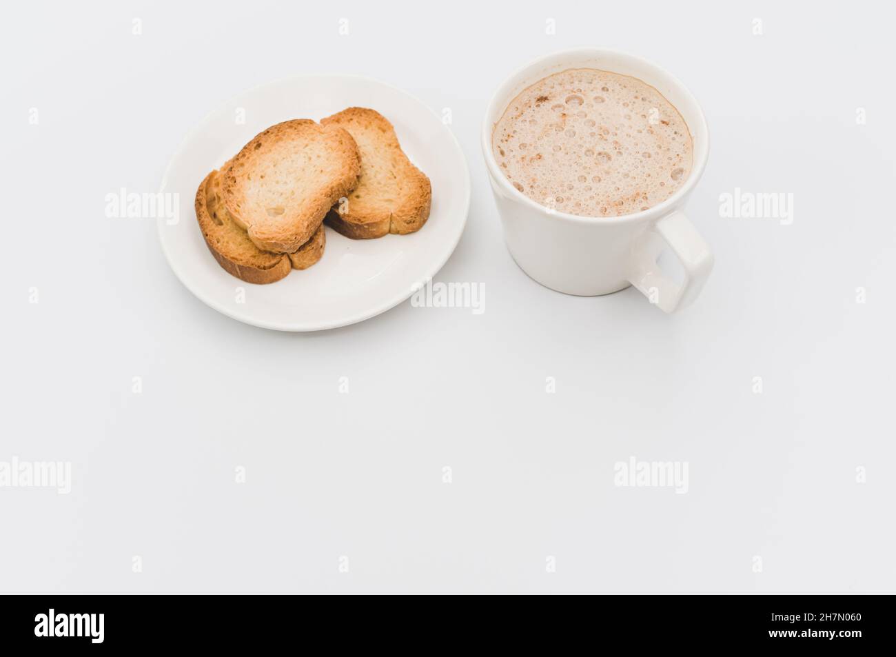 delicious hot vegan Cappuccino with foam in a white cup with crispy ...