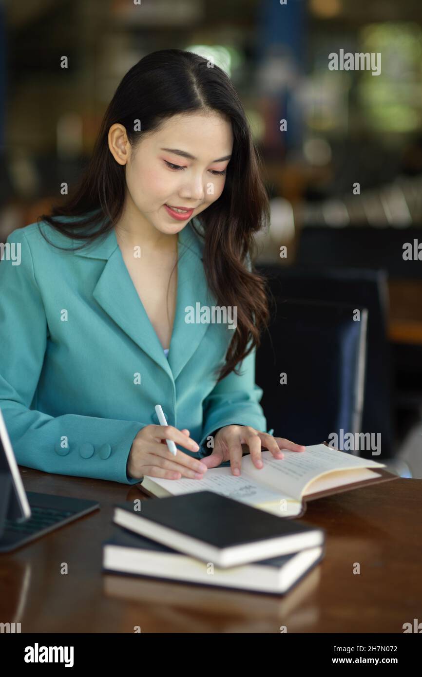 Portrait of beautiful business woman or female college student ...