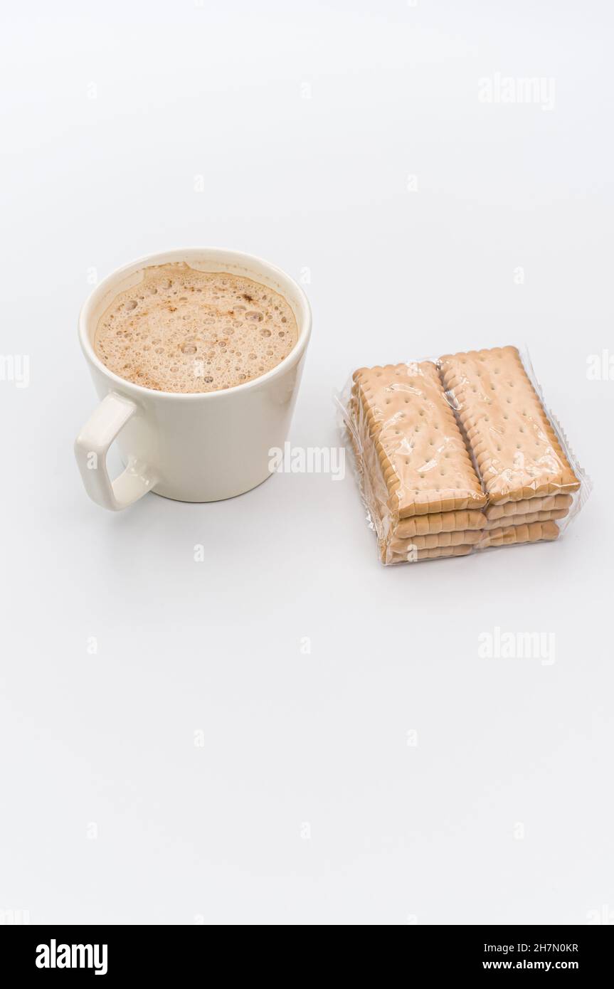 delicious hot vegan Cappuccino with foam in a white cup and packaged ...