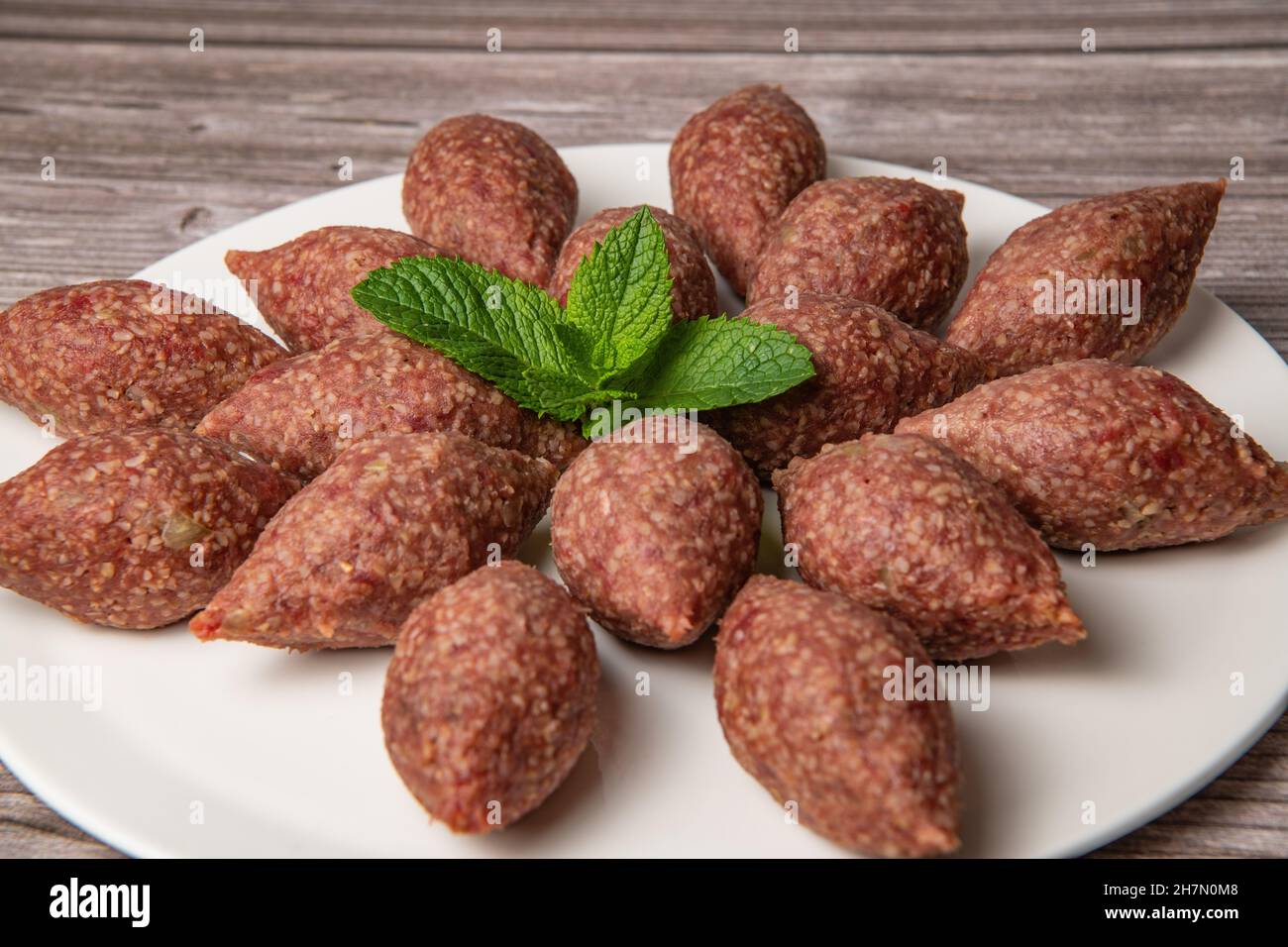Traditional kebbe and pita bread on big round plate in lebanese ...