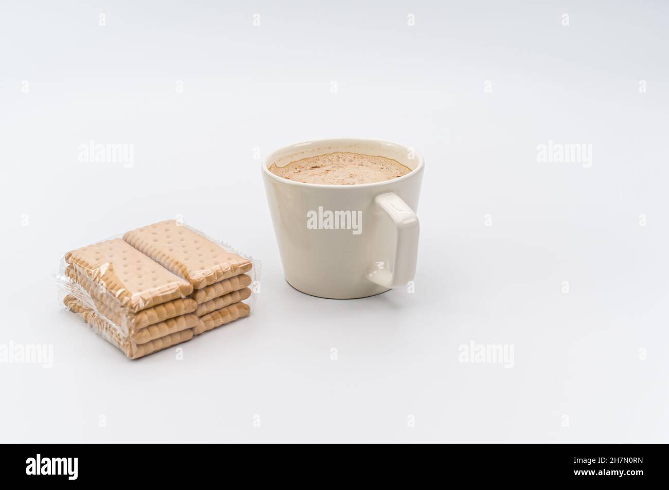 delicious hot vegan Cappuccino with foam in a white cup and packaged ...