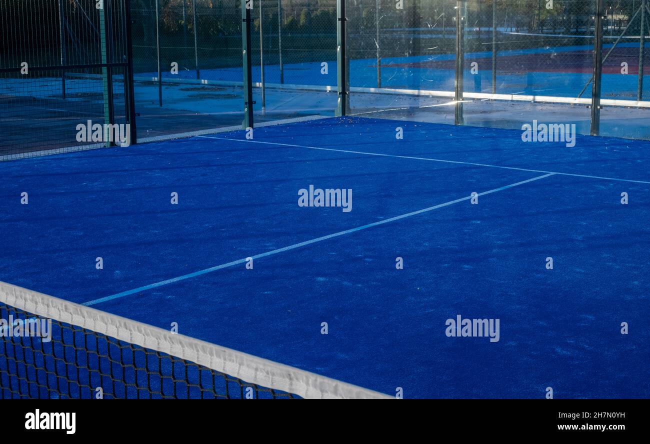 Partial view of a blue paddle tennis court Stock Photo - Alamy