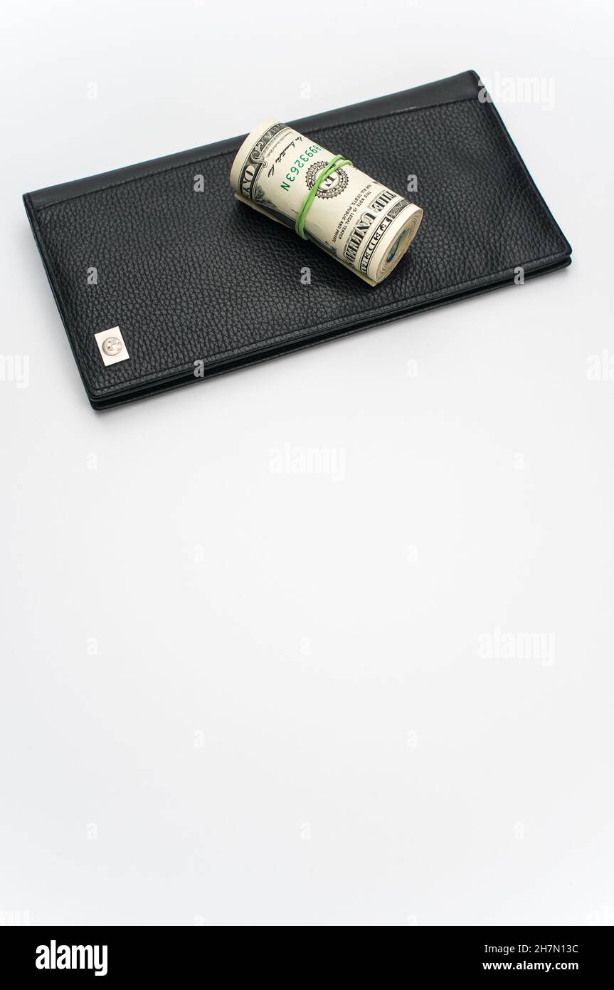 INVERIGO, ITALY - Nov 10, 2021: US dollars wad with luxury black ...