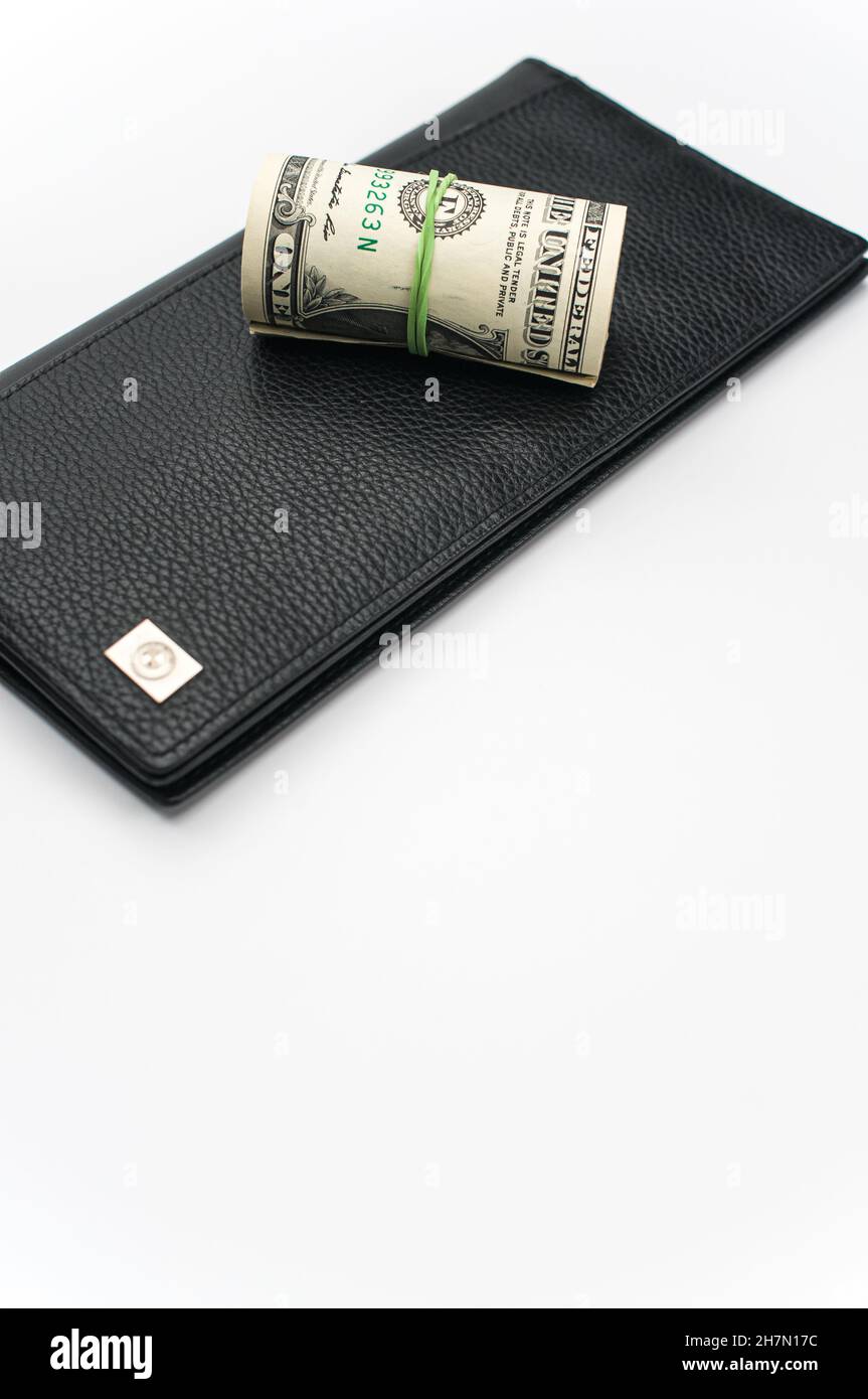INVERIGO, ITALY - Nov 10, 2021: US dollars wad with luxury black ...