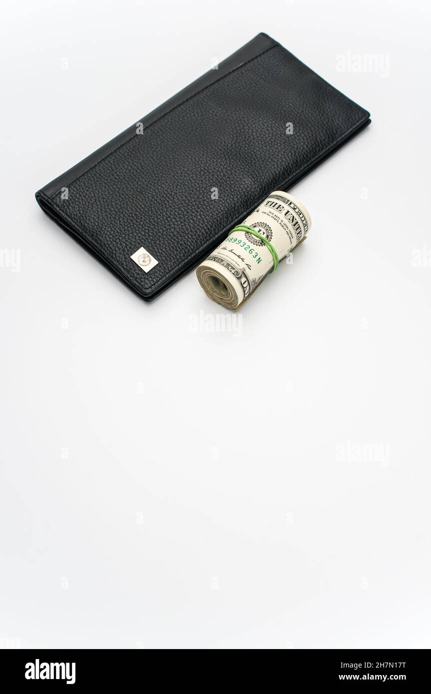 INVERIGO, ITALY - Nov 10, 2021: US dollars wad with luxury black ...