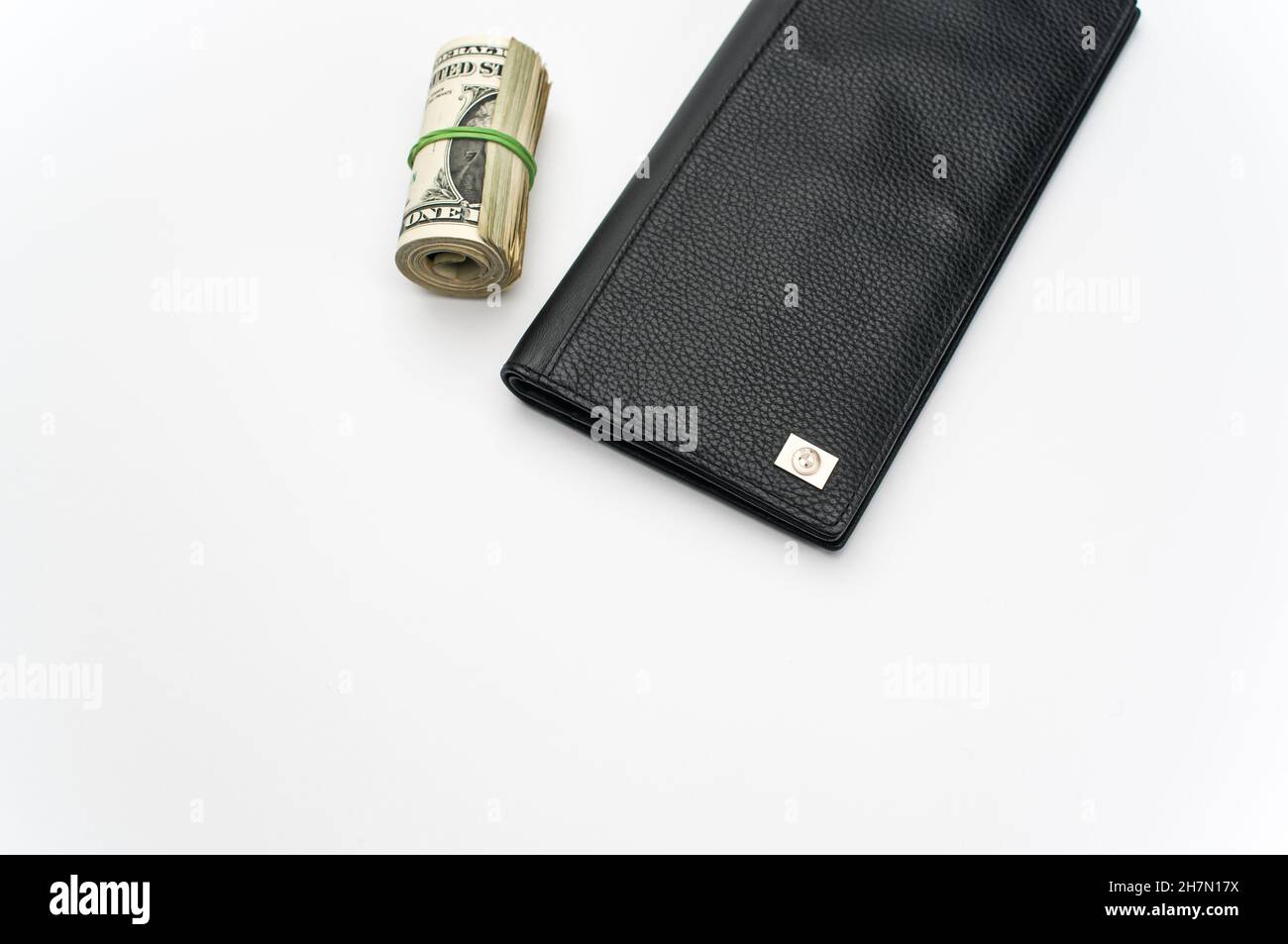 INVERIGO, ITALY - Nov 10, 2021: US dollars wad with luxury black ...