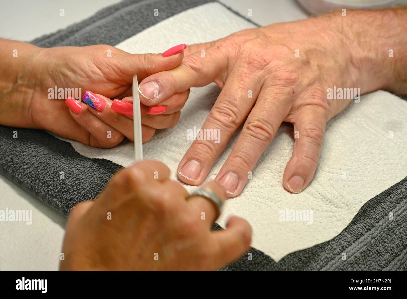 Cosmetic care and treatment of a man's hand, fingernail filing Stock ...