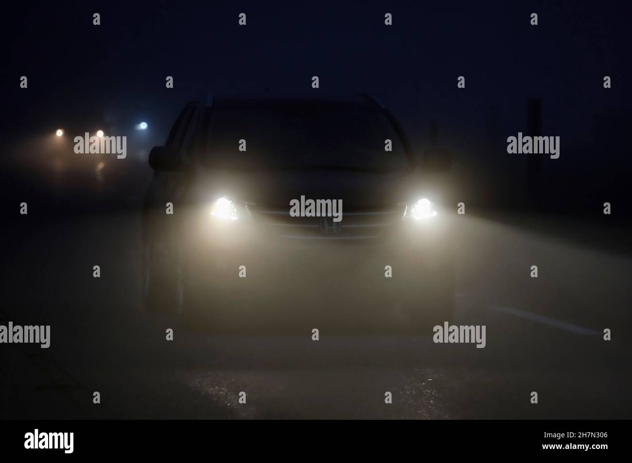 Car by night and fog Stock Photo - Alamy
